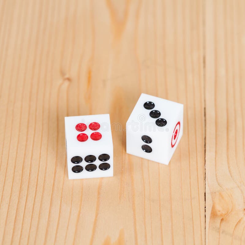 Two dice on wooden table stock image. Image of objects - 79584635
