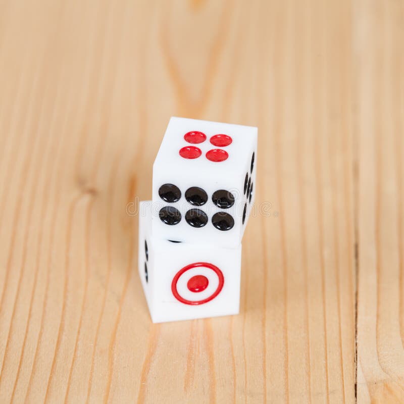 Two dice on wooden table stock image. Image of stake - 79584607