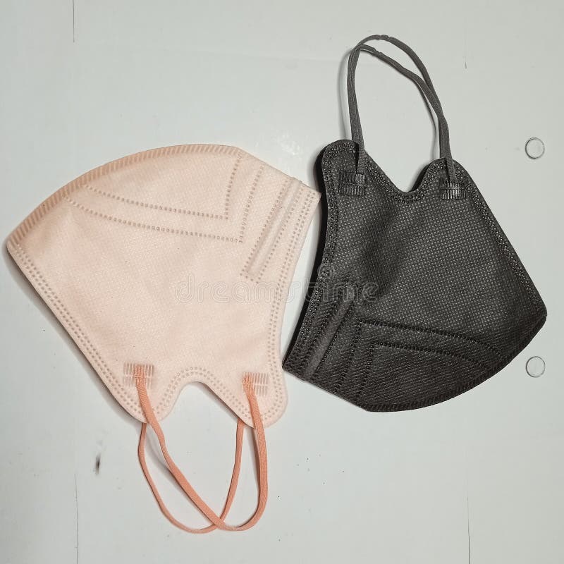 Two Different Colored Face Masks with a White Base Stock Photo - Image ...