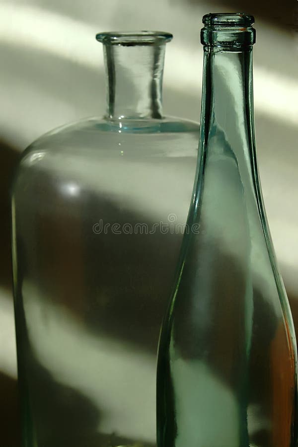Two Different Glass Bottles Stock Image - Image of water, individuality ...