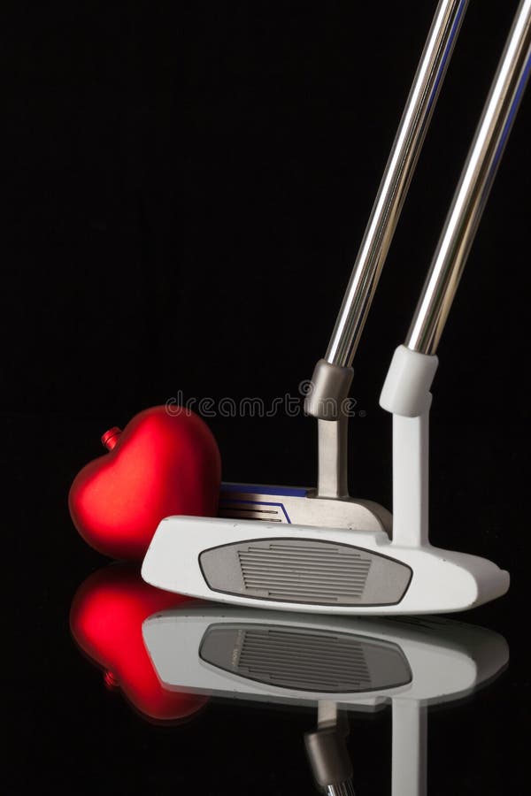 Two Different Golf Putters and Red Heart Stock Photo - Image of emotion ...