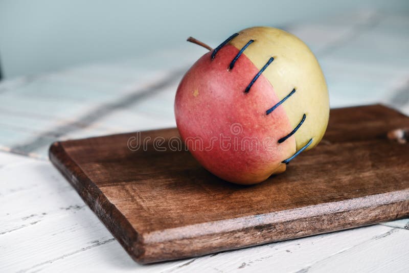 Two Different Halves of Apple Connected by Thread Stock Image - Image ...