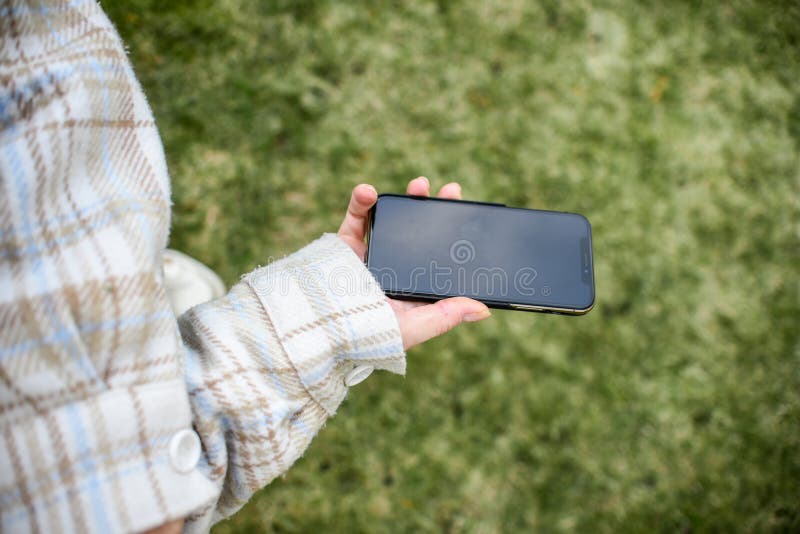Two Different Phones in Woman S Hands, Choosing Better One, Outdoors ...