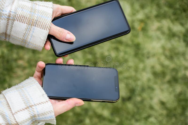 Two Different Phones in Woman S Hands, Choosing Better One, Outdoors ...