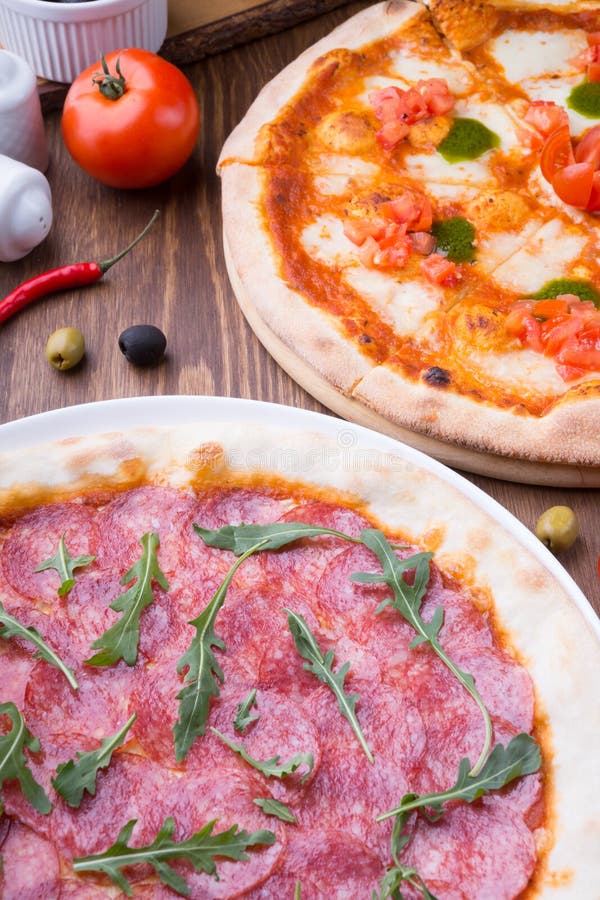 Two Different Pizzas Freshly Baked and Served on Wooden Table Stock ...