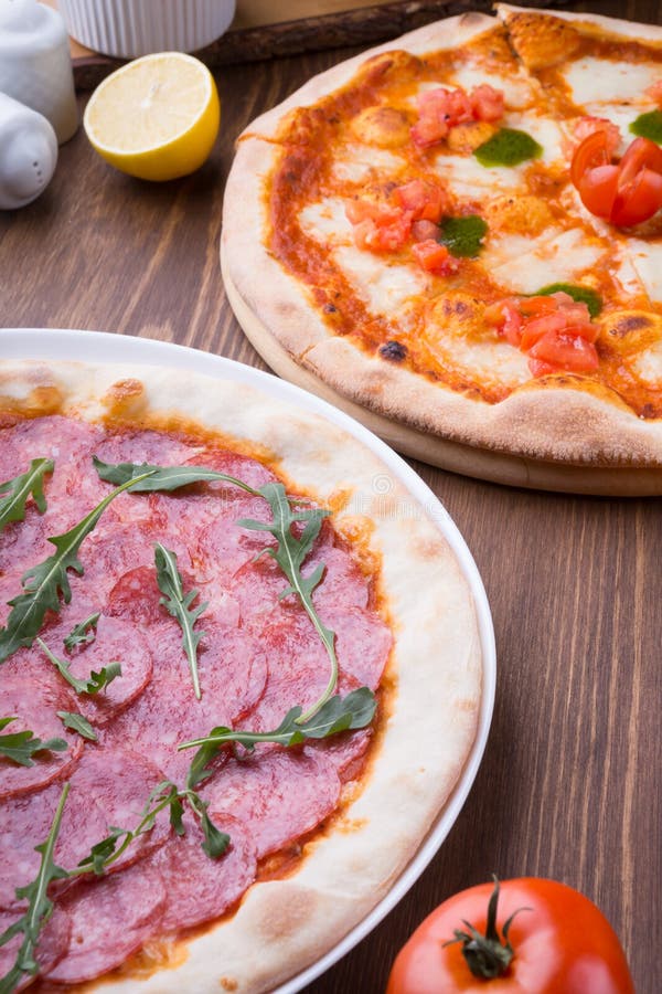 Two Different Pizzas Freshly Baked and Served on Wooden Table Stock ...