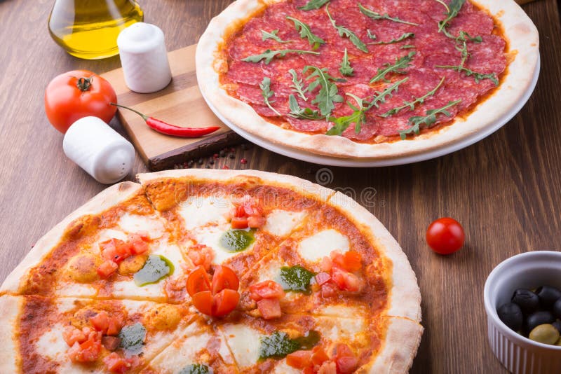 Two Different Pizzas Freshly Baked and Served on Wooden Table Stock ...