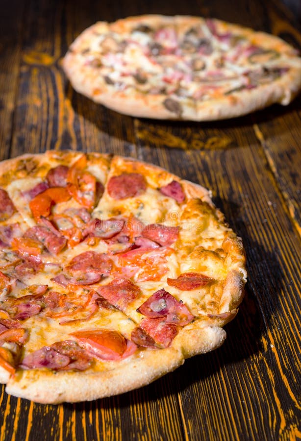 Two Different Pizzas with Variety of Toppings and Cheese Stock Image ...
