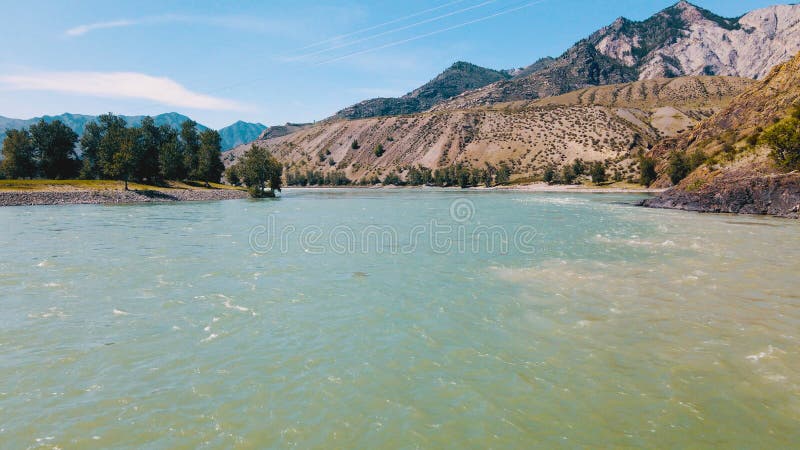 Two Rivers Collide into One with Amazing Mountain View. Drone Footage ...