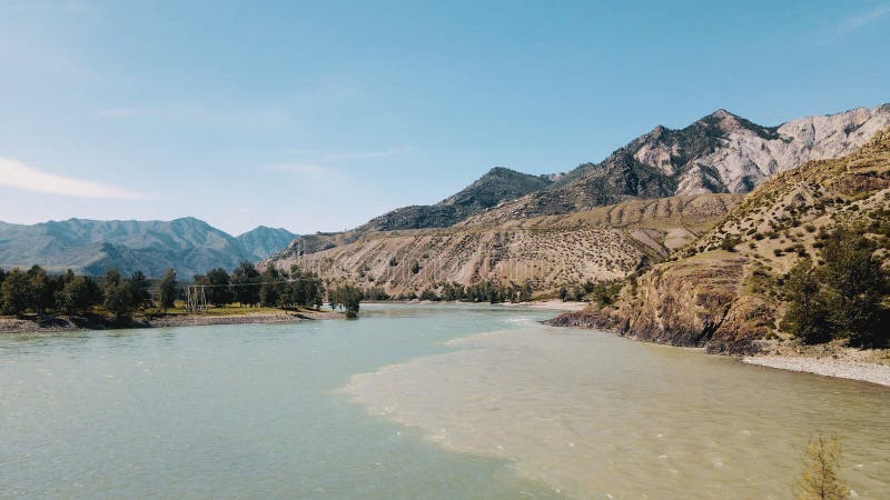 Two Rivers Collide into One with Amazing Mountain View. Drone Footage ...