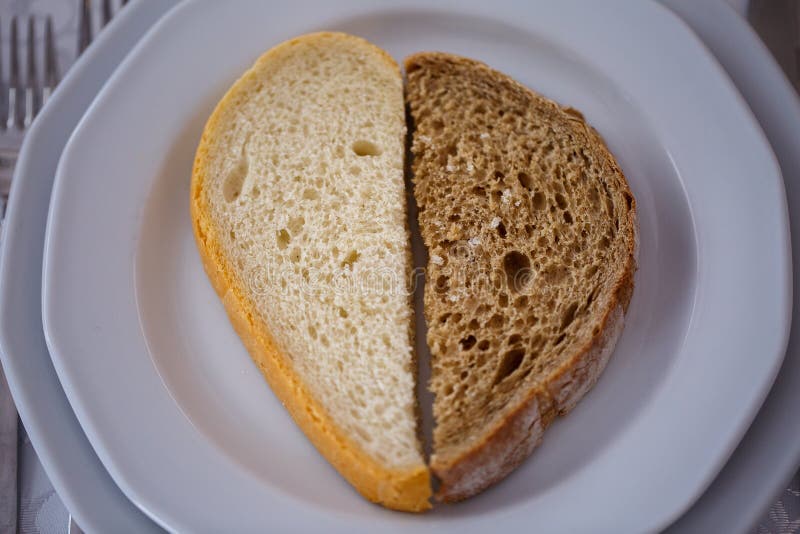Two Different Slices of Bread on a Plate Stock Image - Image of knife ...