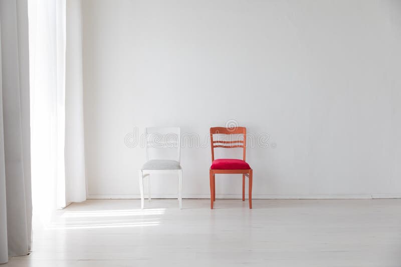 Two Different Vintage Chairs in the Interior of a White Room Stock ...