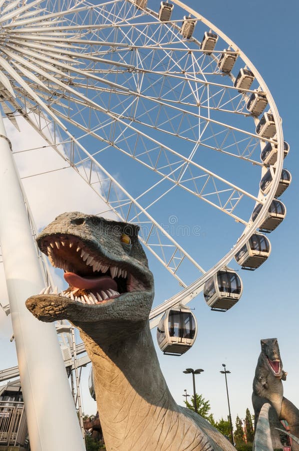 Two Dinosaur and a Ferris Wheel Editorial Photography - Image of ...