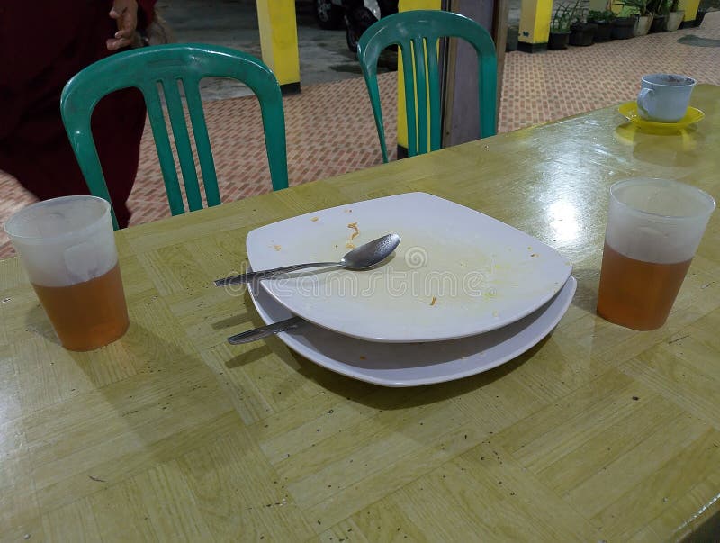 Two Dirty Plates on the Table and Two Half-empty Glasses of Tea Stock ...