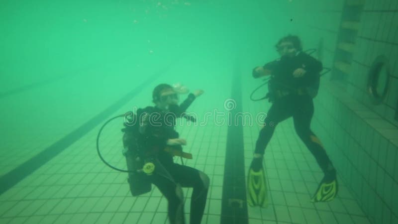 Two Divers with Oxygen Tanks Train Underwater in Stock Video - Video of ...