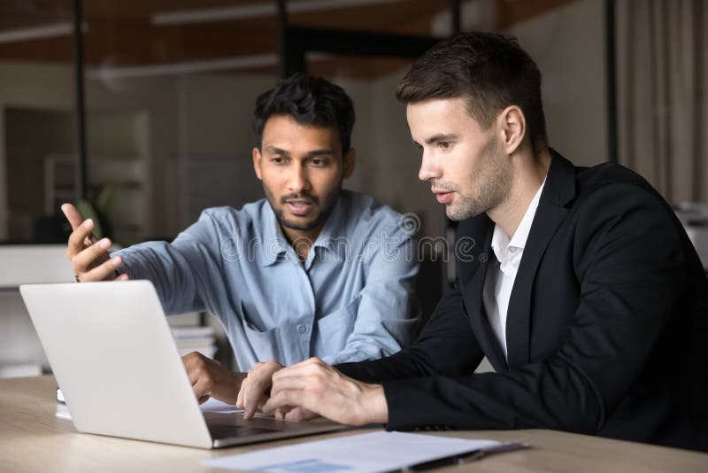 Two Diverse Business Men Talking at Laptop, Discussing Online Job Stock ...