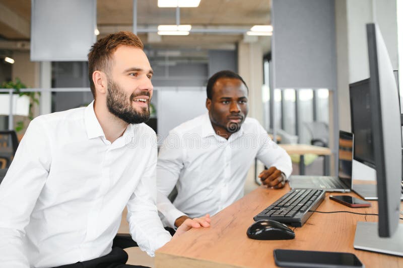 Two Diverse Colleagues Traders Talking To Each Other, Sitting in the ...