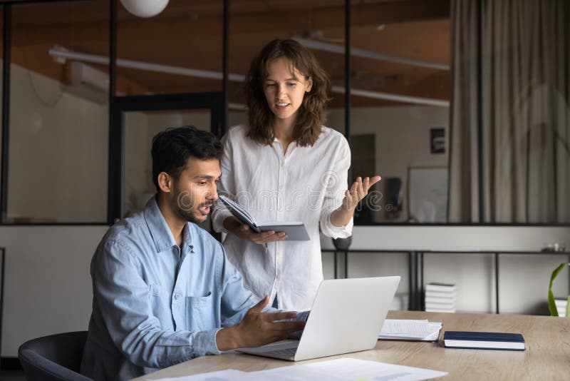 Two Diverse Corporate Colleagues Teamwork Using Laptop Stock Image ...