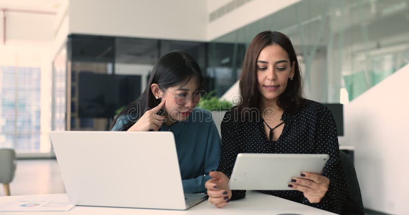 Two Diverse Female Project Colleagues Working on Task Together Stock ...