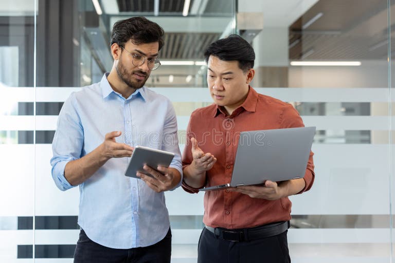Two Diverse Office Workers Discussing Work Project, Serious Men in ...