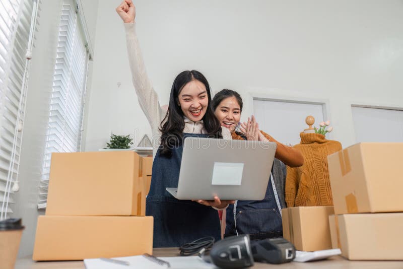Two Diverse Retail Workers Expressing Excitement and Celebration while ...