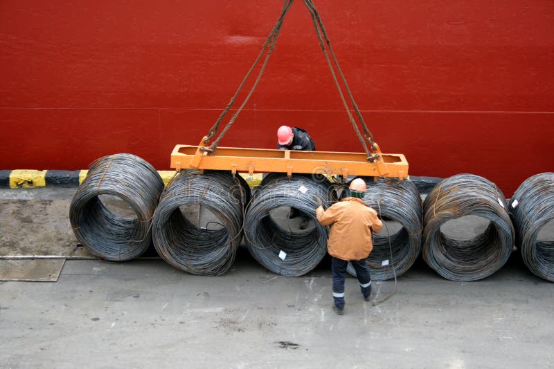 Two Dockers Fix a Cargo of a Wire for Loading Stock Photo - Image of ...