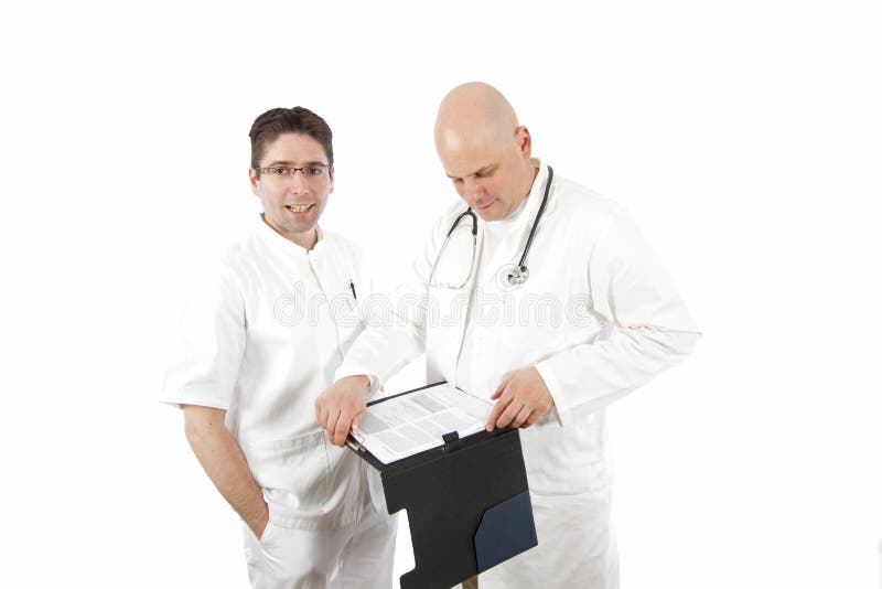Two doctors with a chart stock photo. Image of team, chart - 26117896