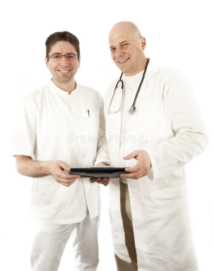 Two doctors with a chart stock photo. Image of success - 26117908