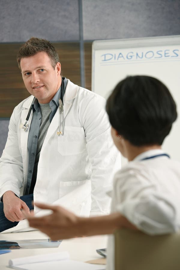 Two doctors chatting stock photo. Image of discussion - 23095882