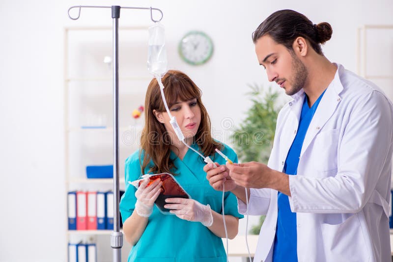 Two Doctors Colleagues Working in the Hospital Stock Photo - Image of ...