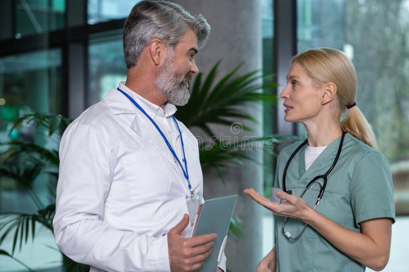 Two Doctors Discussing Medical Case and Looking Involved and Focused ...