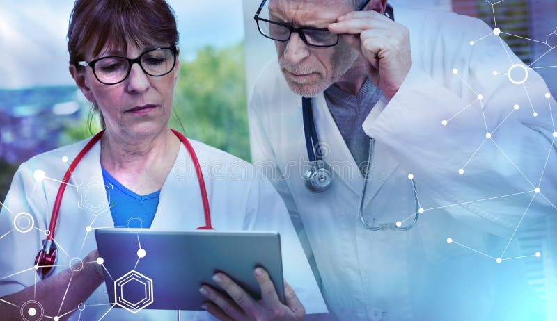 Two Doctors Discussing about Medical Report on Tablet Light Effect ...