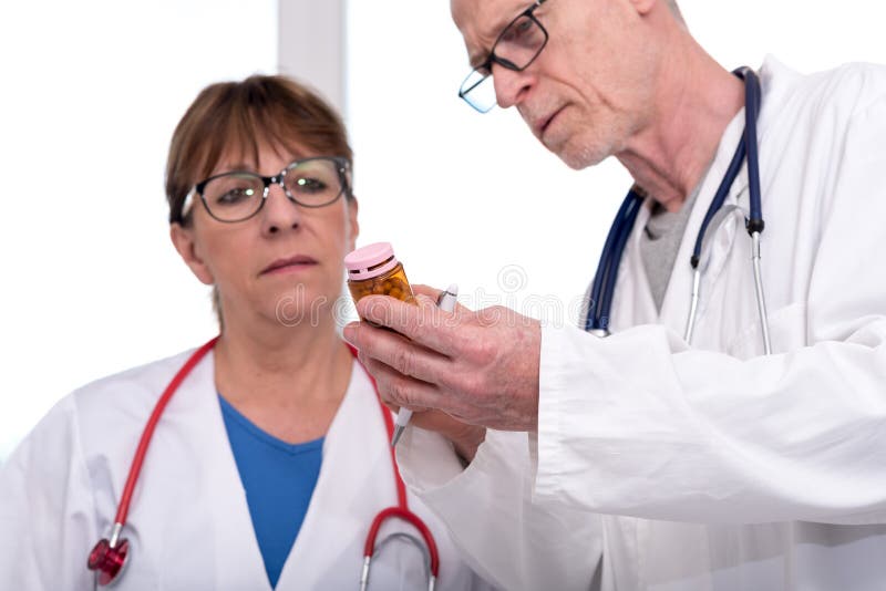 Two Doctors Discussing about Medication Stock Photo - Image of health ...