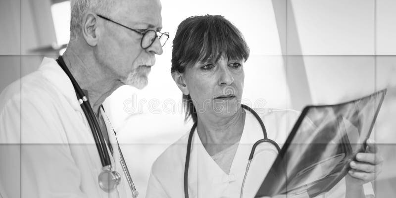 Two Doctors Examining X-ray Report, Geometric Pattern Stock Photo ...