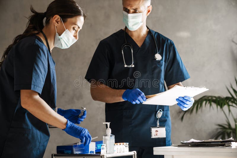 Two Doctors Getting Ready To Have Patients Stock Photo - Image of ready ...