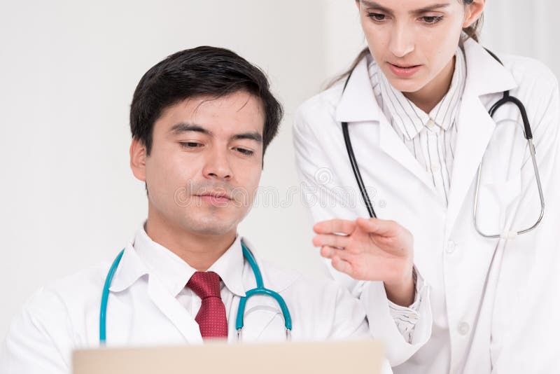 Two Doctors Have Working Together with Happiness in the Hospital Stock ...