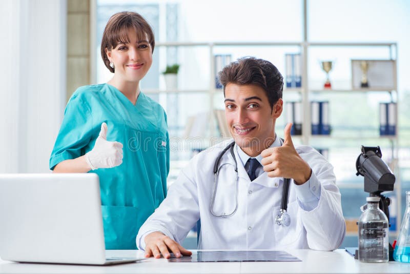 The Two Doctors Having Discussion in the Hospital Stock Image - Image ...