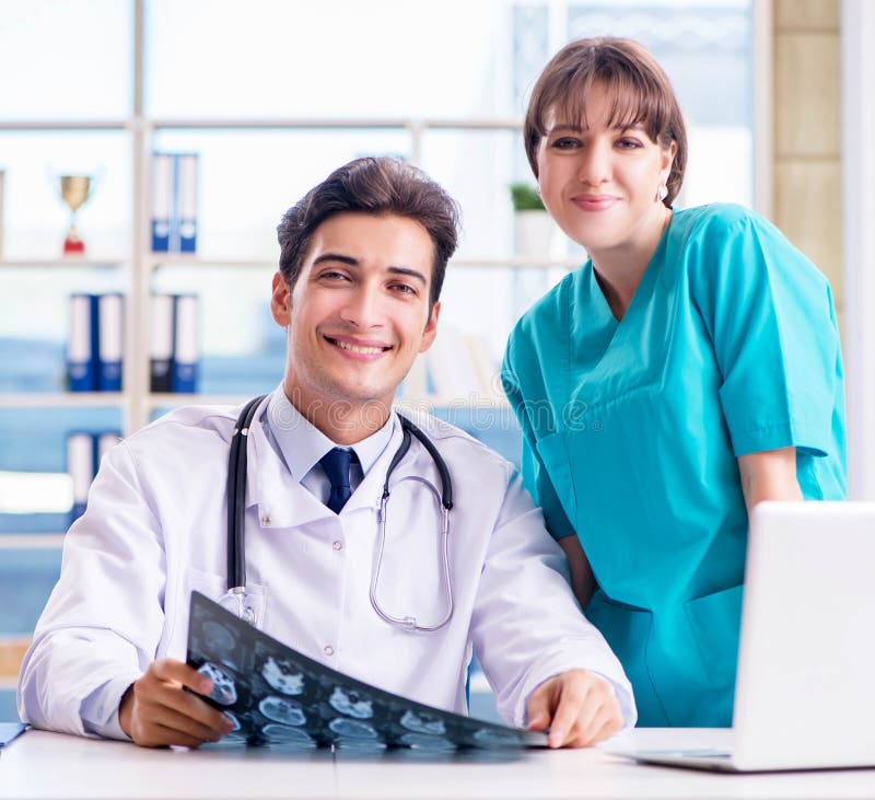 Two Doctors Having Discussion in the Hospital Stock Photo - Image of ...