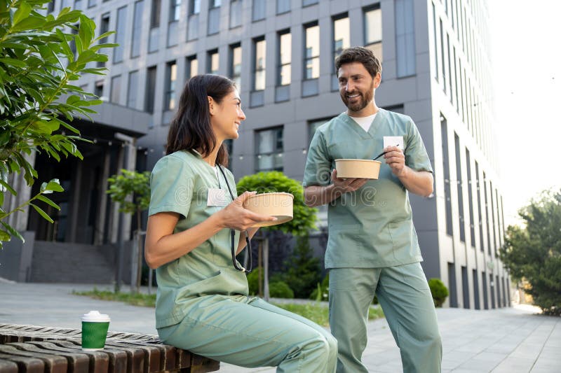 Two Doctors Having Lunch Together in the Clinic Yard Stock Image ...