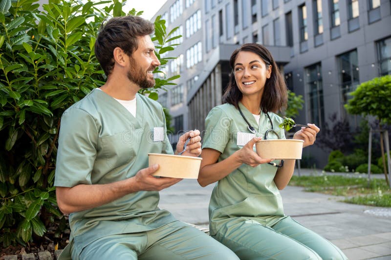 Two Doctors Having Lunch Together in the Clinic Yard Stock Image ...
