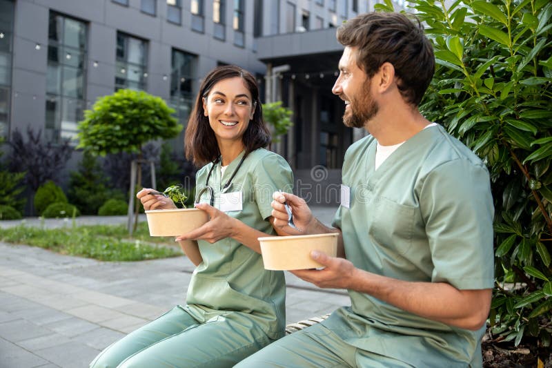 Two Doctors Having Lunch Together in the Clinic Yard Stock Photo ...