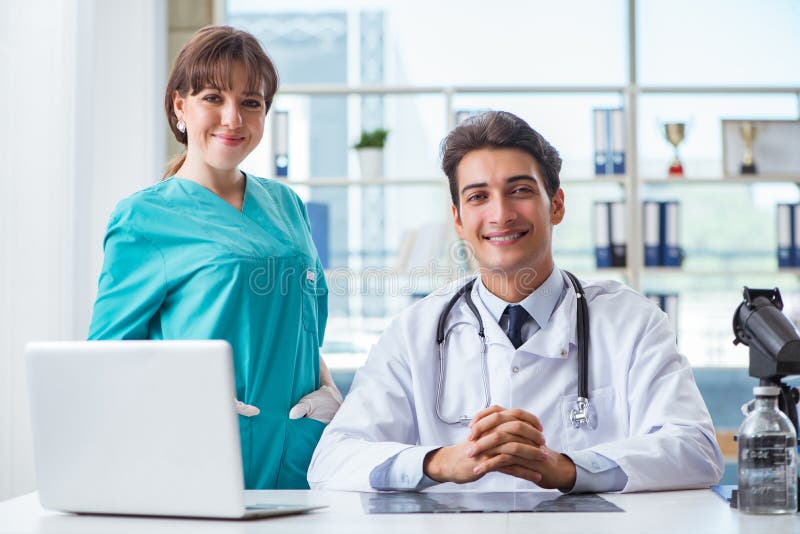The Two Doctors in the Hospital Stock Photo - Image of diagnostic ...