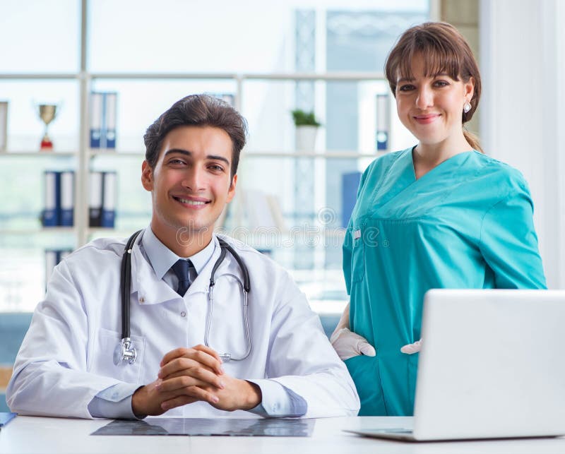 Two Doctors in the Hospital Stock Photo - Image of care, computer ...