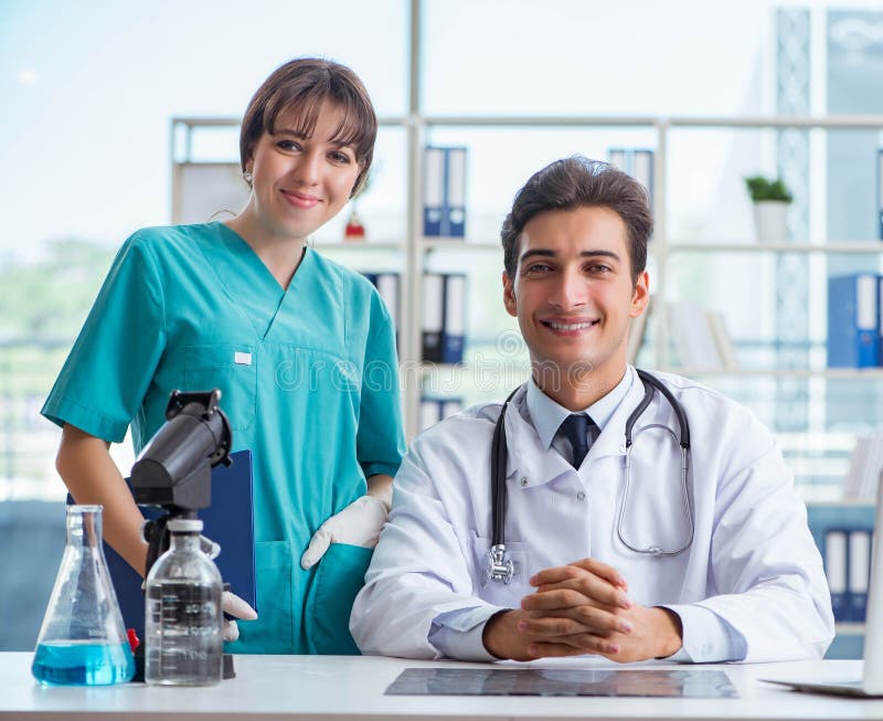 Two Doctors in the Hospital Stock Photo - Image of cure, computer ...