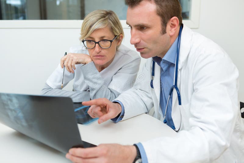 Two Doctors Looking at X-ray Stock Image - Image of scan, spinal: 173080193