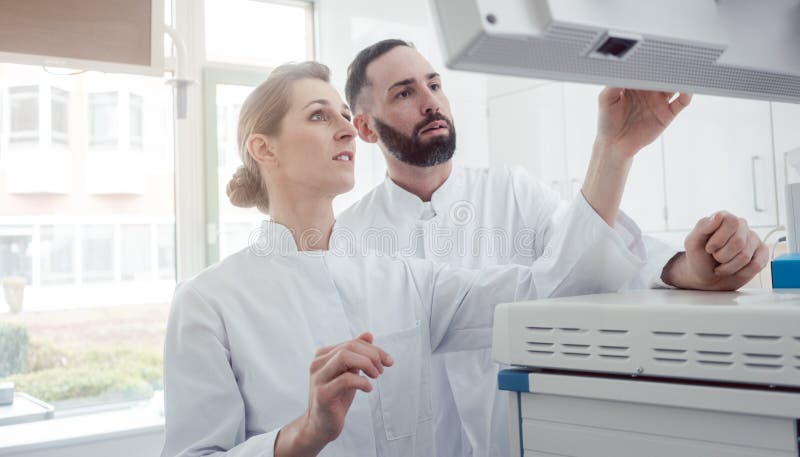 Two Doctors Looking At A Screen With Patient Data Stock Image - Image ...