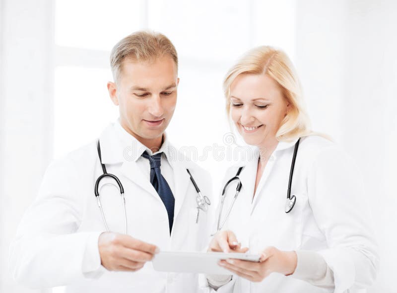 Two Doctors Looking at Tablet Pc Stock Photo - Image of diagnostics ...