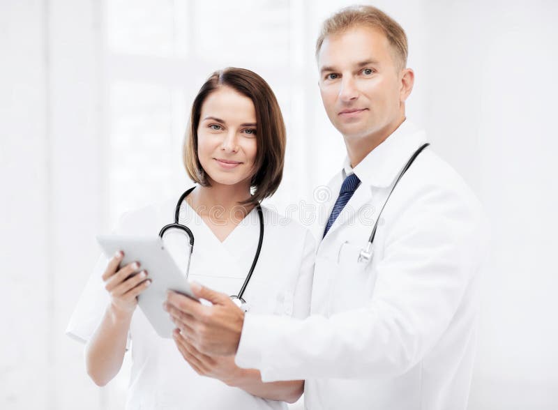 Two Doctors Looking at Tablet Pc Stock Image - Image of education ...