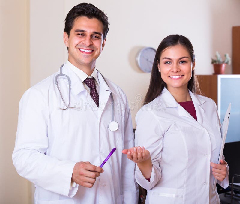 Two Doctors in Private Clinic Stock Image - Image of caucasian, desk ...