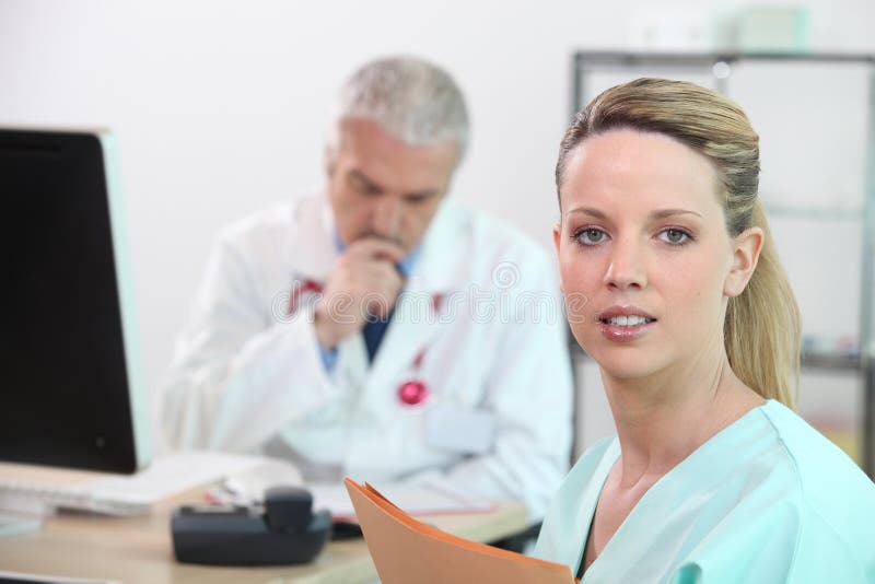 Two Doctors at Reception Desk Stock Photo - Image of laboratory ...